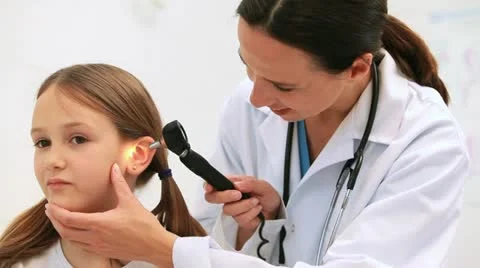 General practitioner auscultating the ea... | Stock Video | Pond5