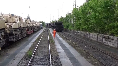 german rail worker walks in front of tra... | Stock Video | Pond5
