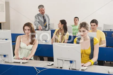 Germany, Emmering, Lecturer training students in computer lab Stock ...