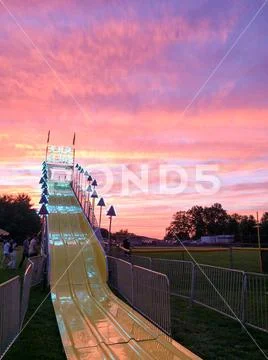 Giant fun slide at fairgrounds at sunset giant fun slide at fairgrounds ...