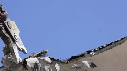 Giant jaws breaking down a building | Stock Video | Pond5