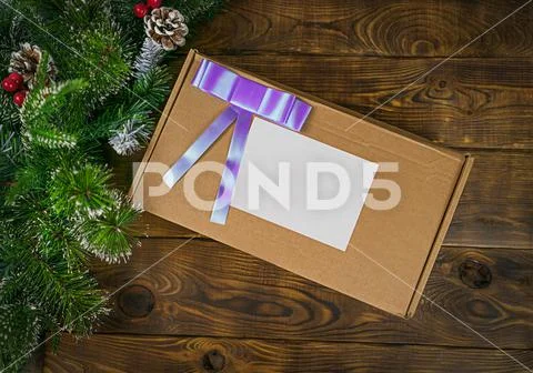 Gift under the tree top view with copy space ~ Premium Photo #166533544