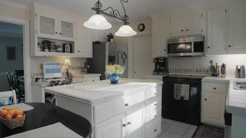 Gimbal shot of and empty white kitchen i... | Stock Video | Pond5
