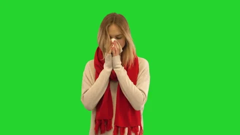 girl and runny nose on a green screen | Stock Video | Pond5