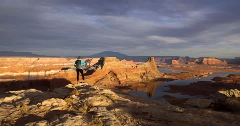 Girl backpacking in rugged Arizona plate... | Stock Video | Pond5