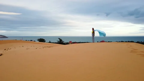 Girl With Beach Scarf Blowing In The Win... | Stock Video | Pond5