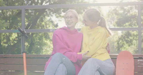 Girl best friends hug each other sitting... | Stock Video | Pond5