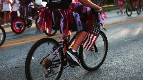 Girl On Bicycle At Fourth Of July Parade... | Stock Video | Pond5