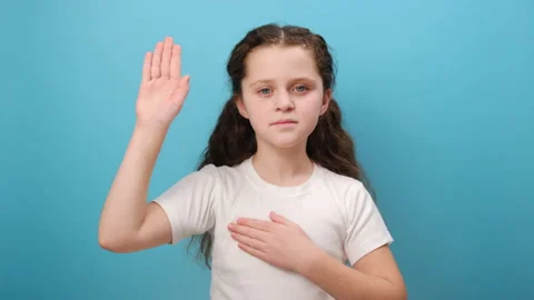Girl child raising her palm to take oath... | Stock Video | Pond5