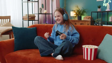 Girl child using joystick controller pla... | Stock Video | Pond5