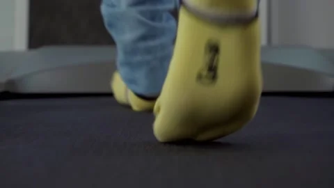 A girl child in yellow socks and jeans w... | Stock Video | Pond5