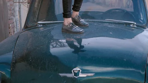 girl dancing on car hood. focus on the l... | Stock Video | Pond5