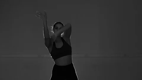 girl dancing modern dance on gray backgr... | Stock Video | Pond5