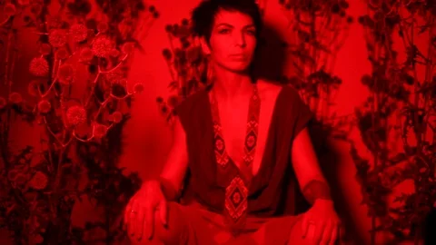 Girl dancing sitting on a chair in red l... | Stock Video | Pond5