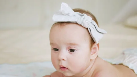 girl in a diaper without clothes | Stock Video | Pond5