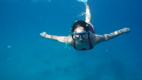 Girl dive in the Red sea with underwater... | Stock Video | Pond5