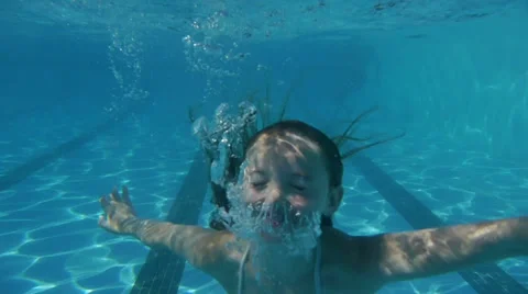 Girl diving in Swimming Pool. Kids. Slow... | Stock Video | Pond5