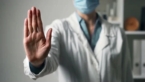 girl doctor shows stop hand gesture The ... | Stock Video | Pond5