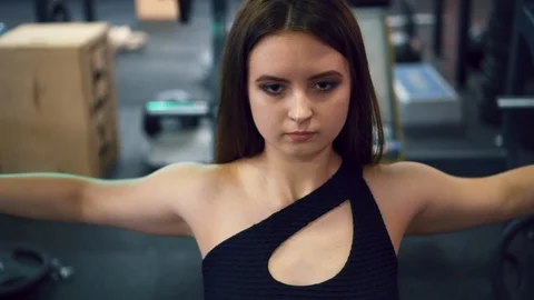 Girl doing butterfly chest workout | Stock Video | Pond5