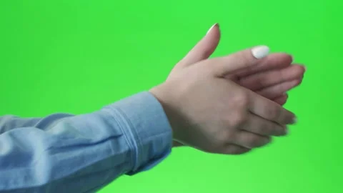 Girl doing claps her hands on a green sc... | Stock Video | Pond5