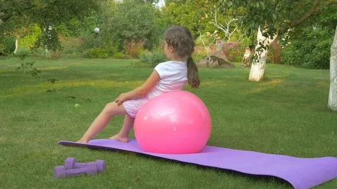 The girl doing exercises with ball in ga... | Stock Video | Pond5