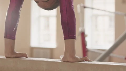 Girl Doing Handstand Split on Beam in Gy... | Stock Video | Pond5