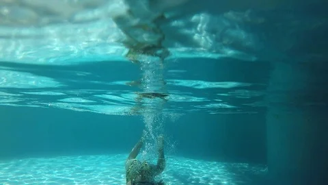 Girl doing an underwater handstand in th... | Stock Video | Pond5