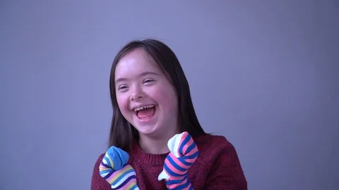 Girl with Down Syndrome have fun with di... | Stock Video | Pond5