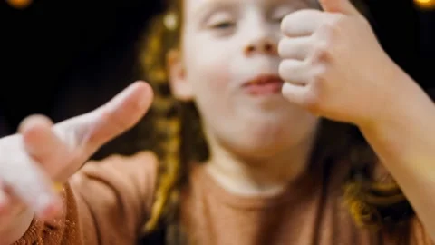 The girl eats donuts. Chocolate, marshme... | Stock Video | Pond5