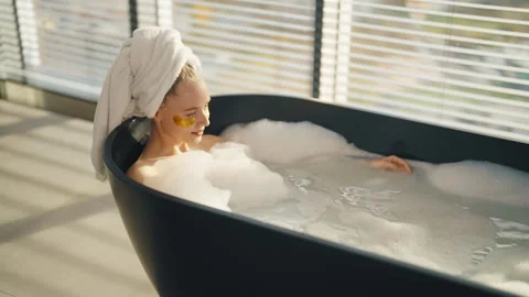 Girl enjoying taking bath with foam. | Stock Video | Pond5
