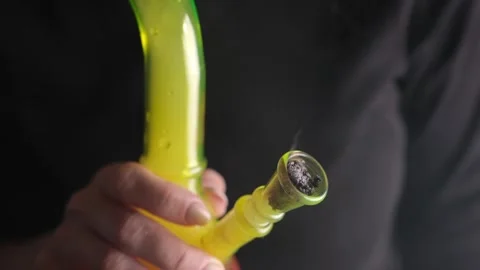 Girl Exhales Weed Smoke While Smoking Bo... | Stock Video | Pond5