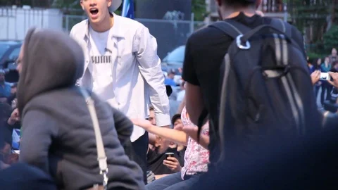 Girl flashing crowd by lifting her shirt... | Stock Video | Pond5