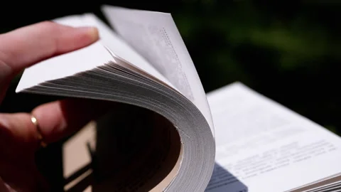 Girl Flipping through the Pages of an Op... | Stock Video | Pond5