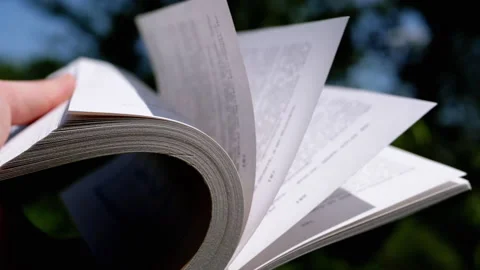 Girl Flipping through the Pages of an Op... | Stock Video | Pond5
