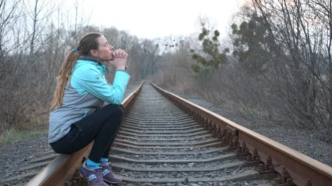 The girl goes by rail. A lonely girl goe... | Stock Video | Pond5