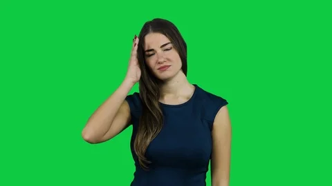 Girl having a headache in front of a gre... | Stock Video | Pond5
