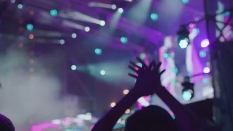 A girl at an indoor concert is dancing, ... | Stock Video | Pond5