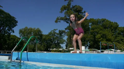 Girl Jumping and diving in Swimming Pool... | Stock Video | Pond5