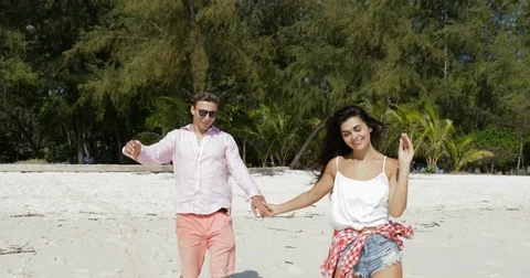 Girl Lead Man On Beach Holding Hand, Cou... | Stock Video | Pond5