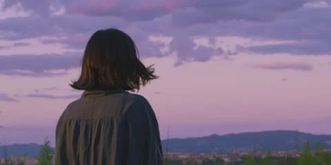 Girl looking up to the sky during the su... | Stock Video | Pond5