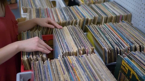 Girl Looking Through Records at Music St... | Stock Video | Pond5