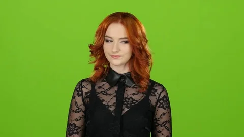 Girl looks around and cute smile. Green ... | Stock Video | Pond5