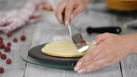 A girl making a cake in a bakery. Baker ... | Stock Video | Pond5
