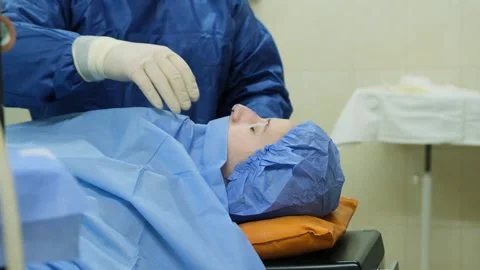 A girl on the operating table under anes... | Stock Video | Pond5