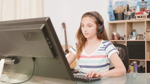 Girl playing on her computer an online g... | Stock Video | Pond5