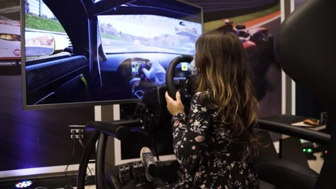 Girl playing in a racing simulator cockp... | Stock Video | Pond5