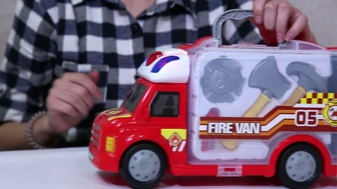 Girl playing with toy fire-engine vehicl... | Stock Video | Pond5