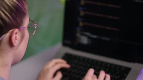 Girl programmer sits in front of a compu... | Stock Video | Pond5