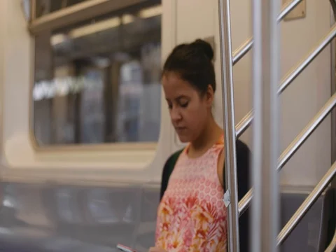 Girl riding on a new york city subway tr... | Stock Video | Pond5