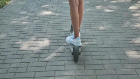 A girl rolls around on city tiles in the... | Stock Video | Pond5